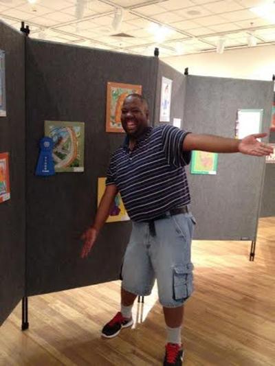 FIRST PLACE: Reggie wins Kaleidoscope Art Show, see page 11 ...