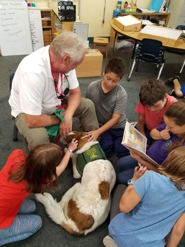 Dogs read to children as part of reading program | The Daily Sun ...