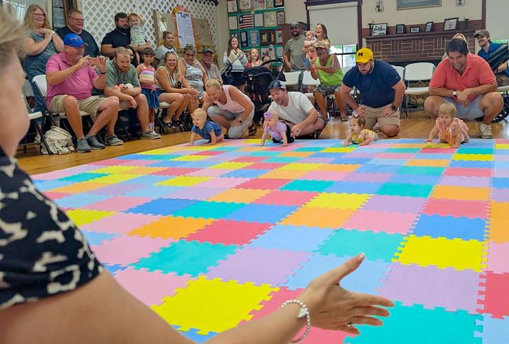 Crawling to victory: Girls win the 2025 Diaper Derby race | News ...