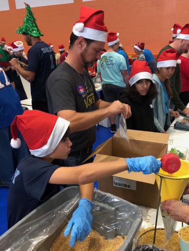 Rotarians, volunteers bag 169,000 meals for those in need | News ...