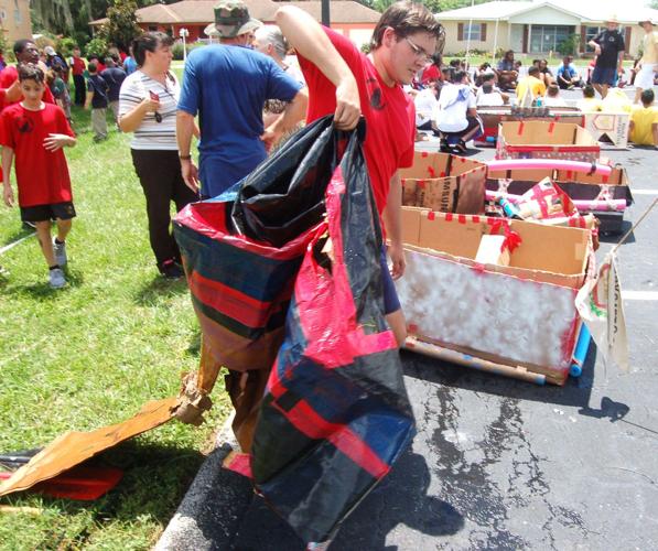 Reading, writing and rowing: Cardboard boat rowing regatta opens school ...