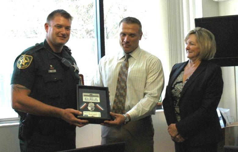 Sheriff’s deputy receives retirement credentials from DEA ...
