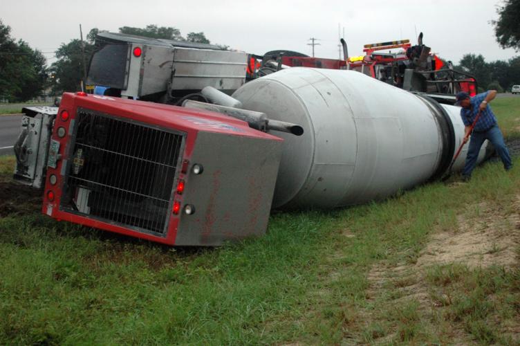Driver safe after concrete truck tips over on highway | Newsarchives ...