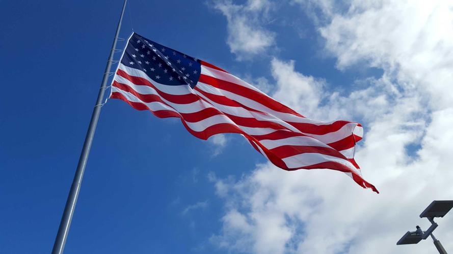 County's largest flag raised at Alan Jay Ford | News | yoursun.com