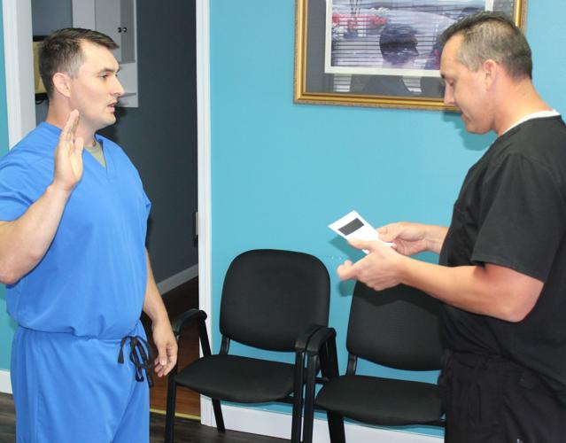 Making it official: Dr. Crupi administers oath to Army Reserve recruit ...