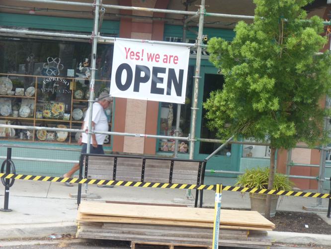 Scaffolding envelopes Johnson-Schoolcraft Building in downtown Venice ...