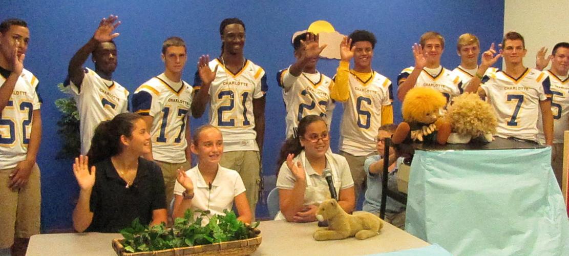 Football players promote reading at Peace River | News Archives ...