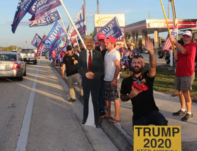 Trump supporters wave flags to celebrate the president | The Daily Sun ...